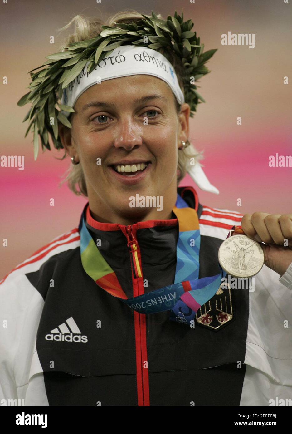 Germany's Steffi Nerius displays her javelin silver medal, following the medal presentation ...