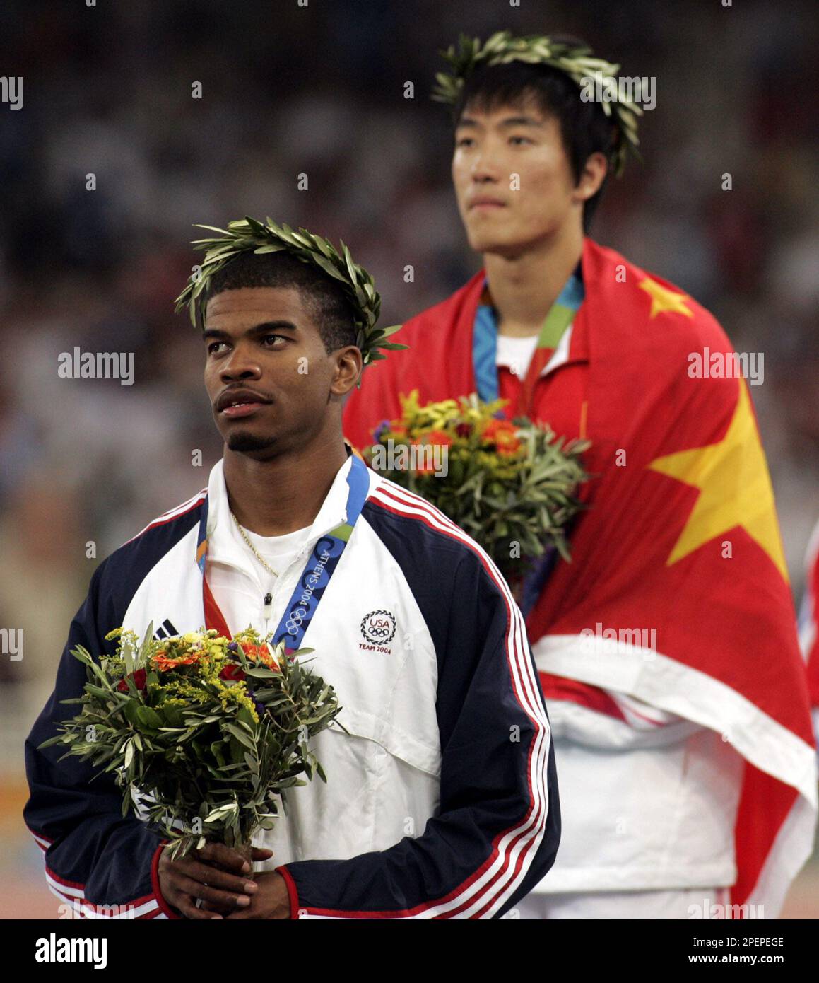 Silver-medalist Terrence Trammell, left, and gold-medalist Liu Xiang of ...