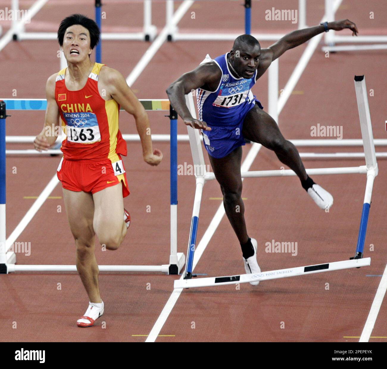 China's Liu Xiang wins the gold medal in the 110-meter hurdles as ...