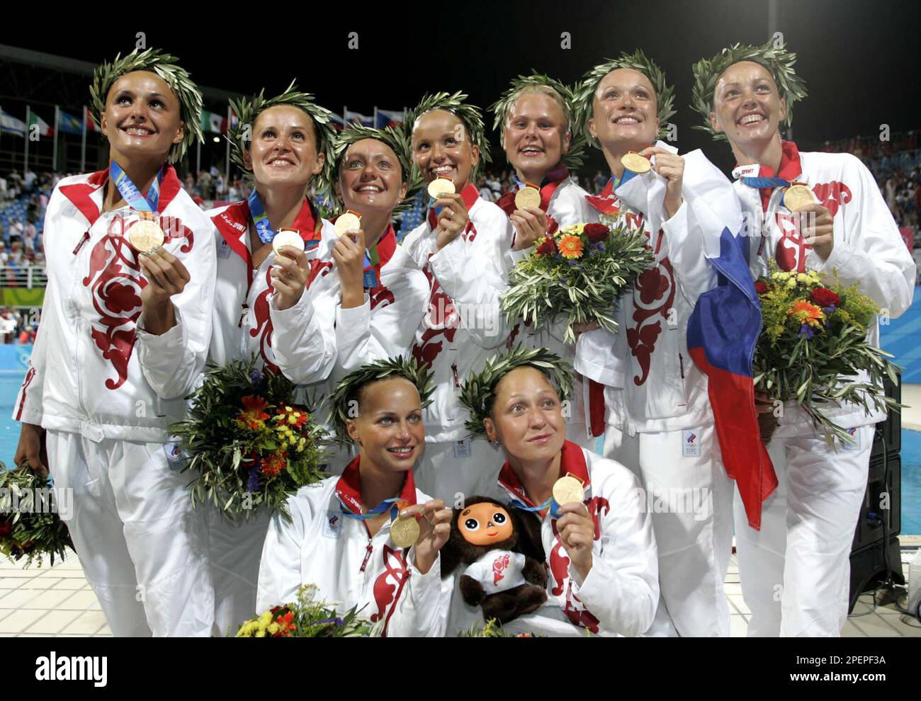 Members of Russia's team show their gold medals following the medal ...