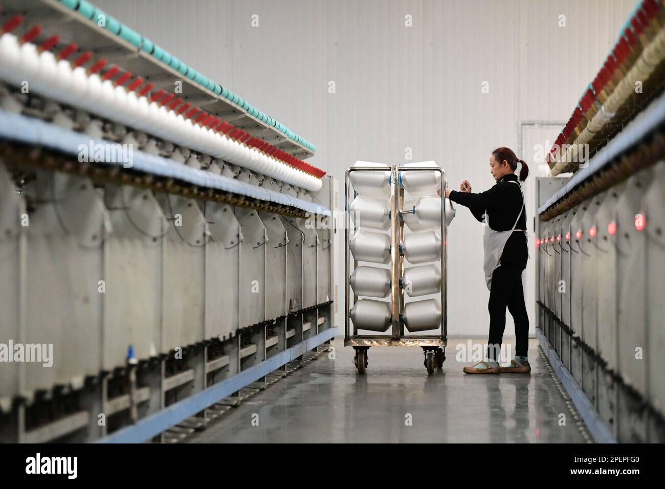 HAI'AN, CHINA - MARCH 16, 2023 - A worker produces nylon high-strength ...