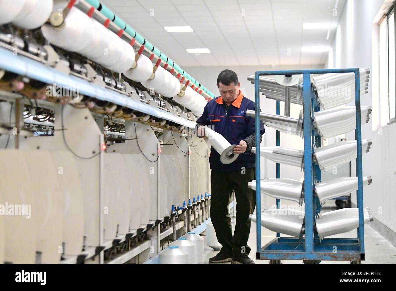HAI'AN, CHINA - MARCH 16, 2023 - A worker produces nylon high-strength ...