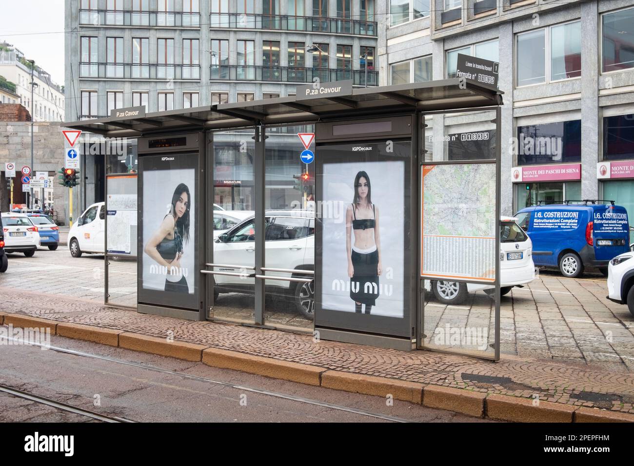 Tram stop in Milano city center piazza Cavour, Italy. Advertising of Miu Miu brand Stock Photo ...