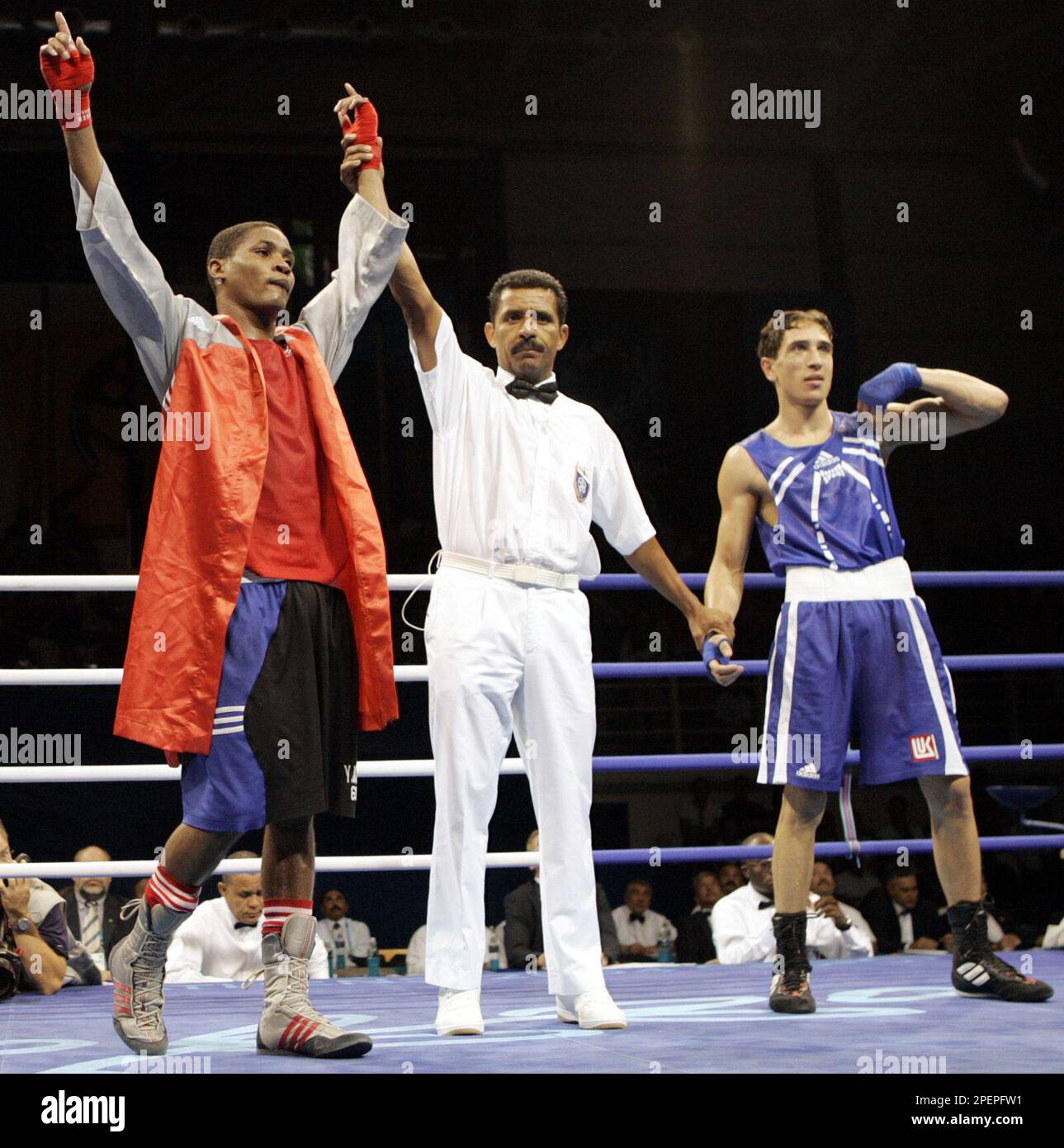 Cuba's Yudel Johnson Cedeno, left, celebrates his victory over Bulgaria ...