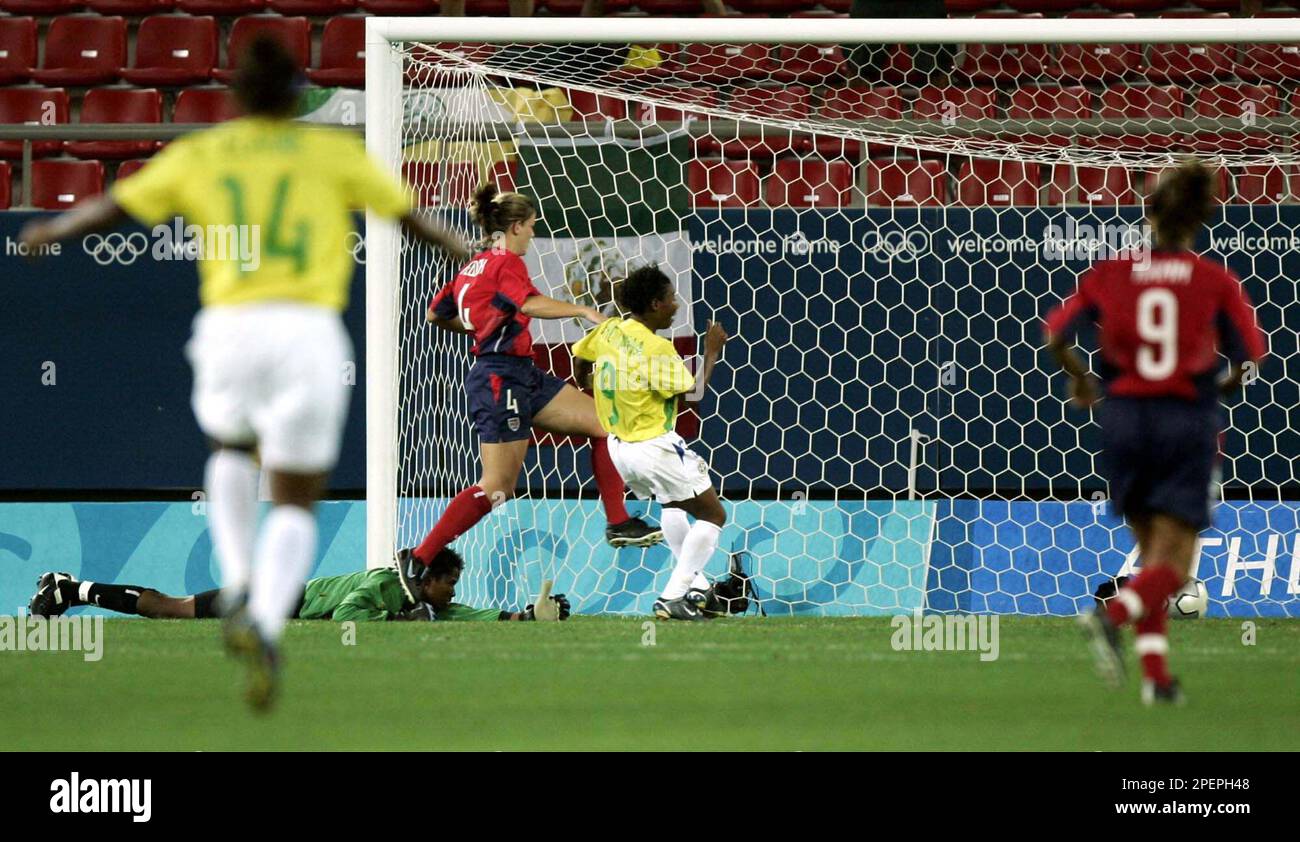 Brazil's forward Pretinha, center, scores as USA's Cat Reddick, third ...