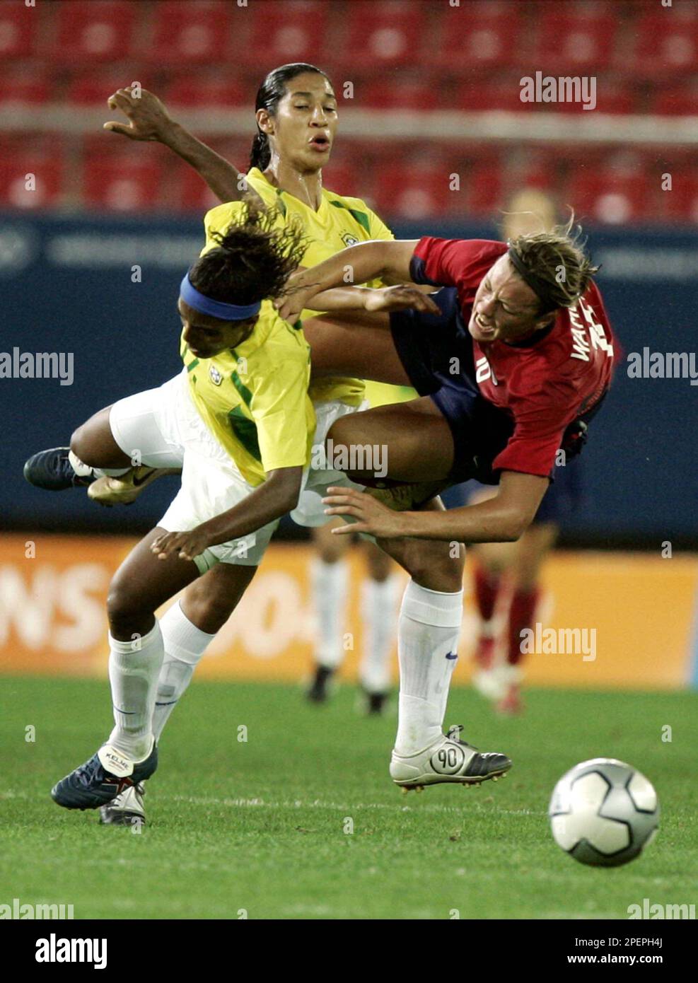 Brazil's Elaine, left, and Daniela, back, block USA's Abby Wambach ...