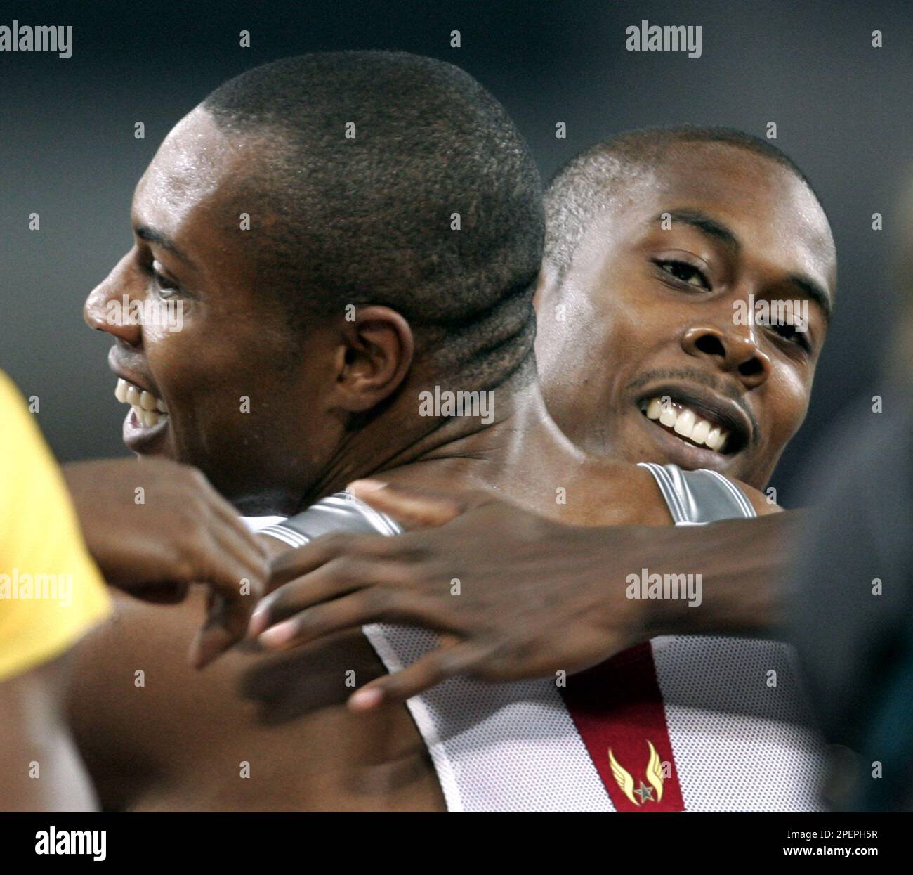 United States' Shawn Crawford, right, is congratulated by Bernard ...