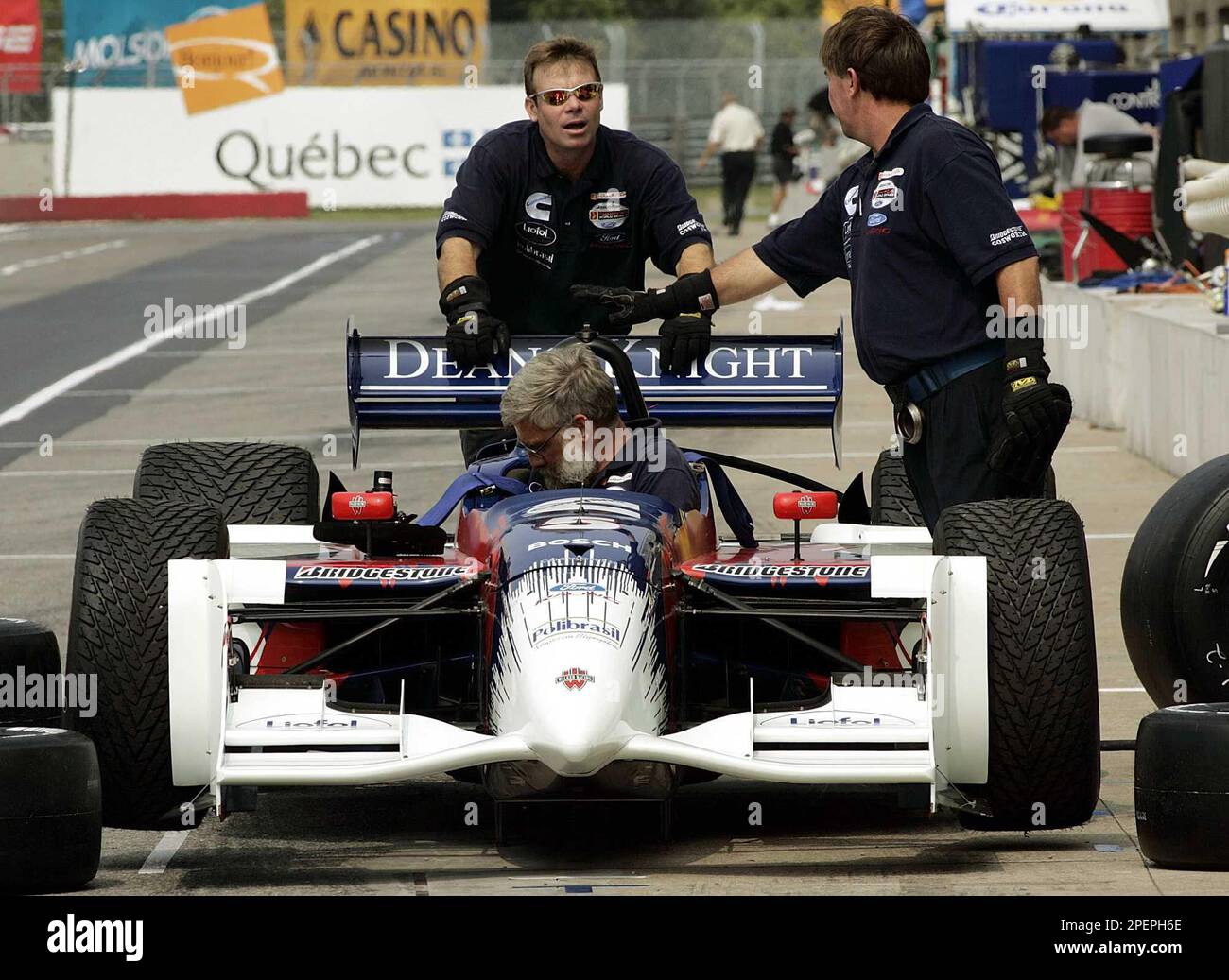 Members of the Walker Racing team practice pit stops with Mario ...