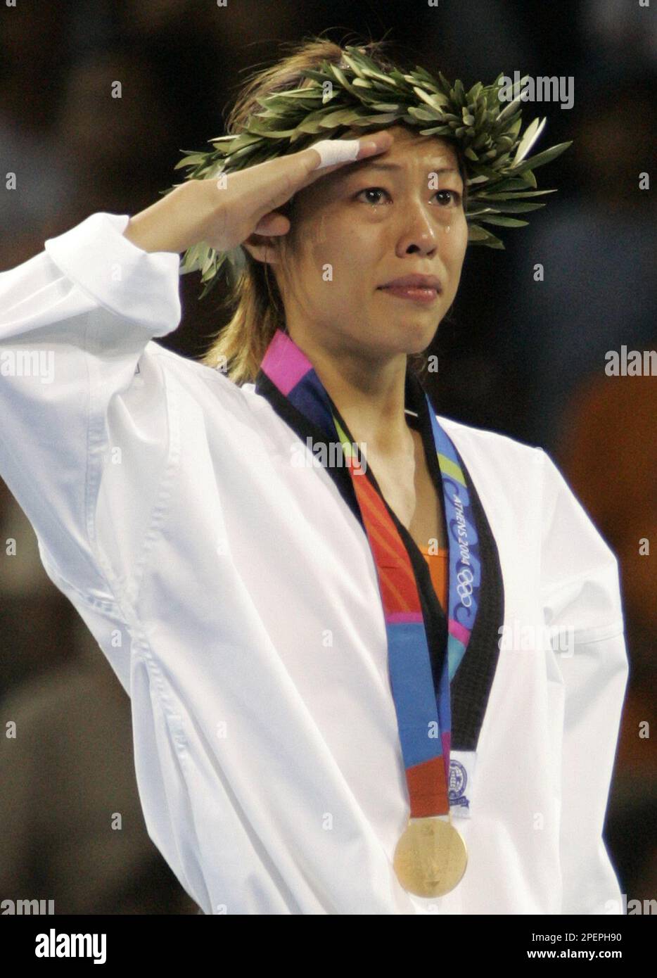 Shih Hsin Chen, from Taiwan, cries as she salutes while her anthem is ...