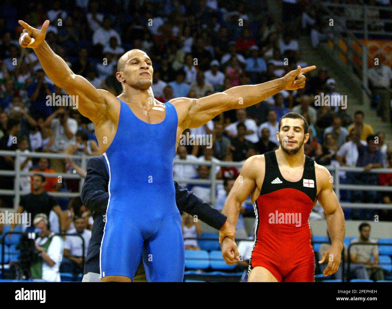 Karam Ibrahim of Egypt, celebrates after defeating Ramaz Nozadze of ...