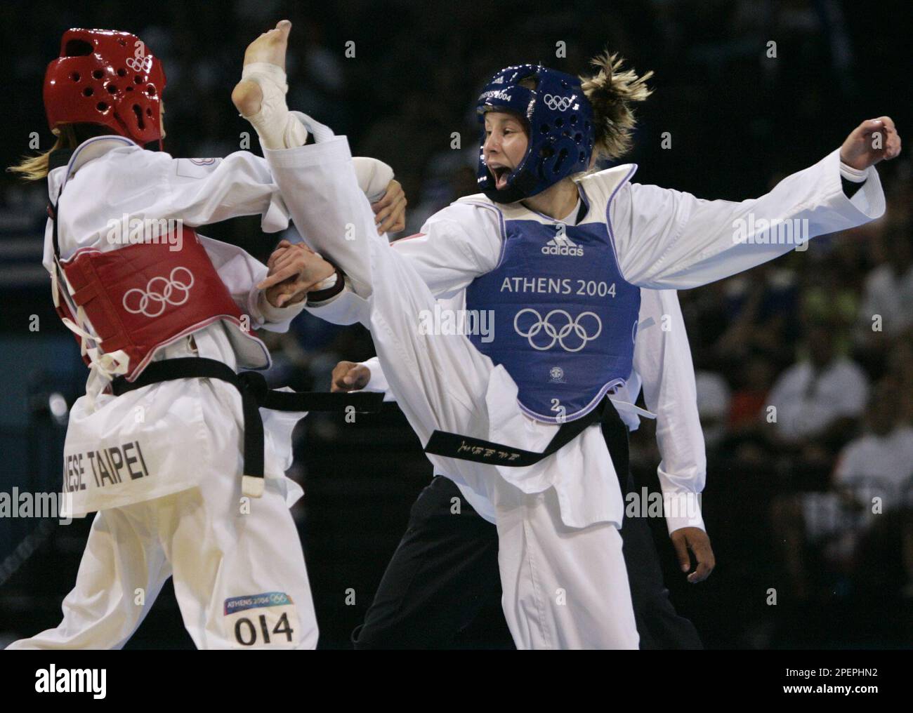 Ivett Gonda, left, from Canada, competes with Shih Hsin Chen, from ...