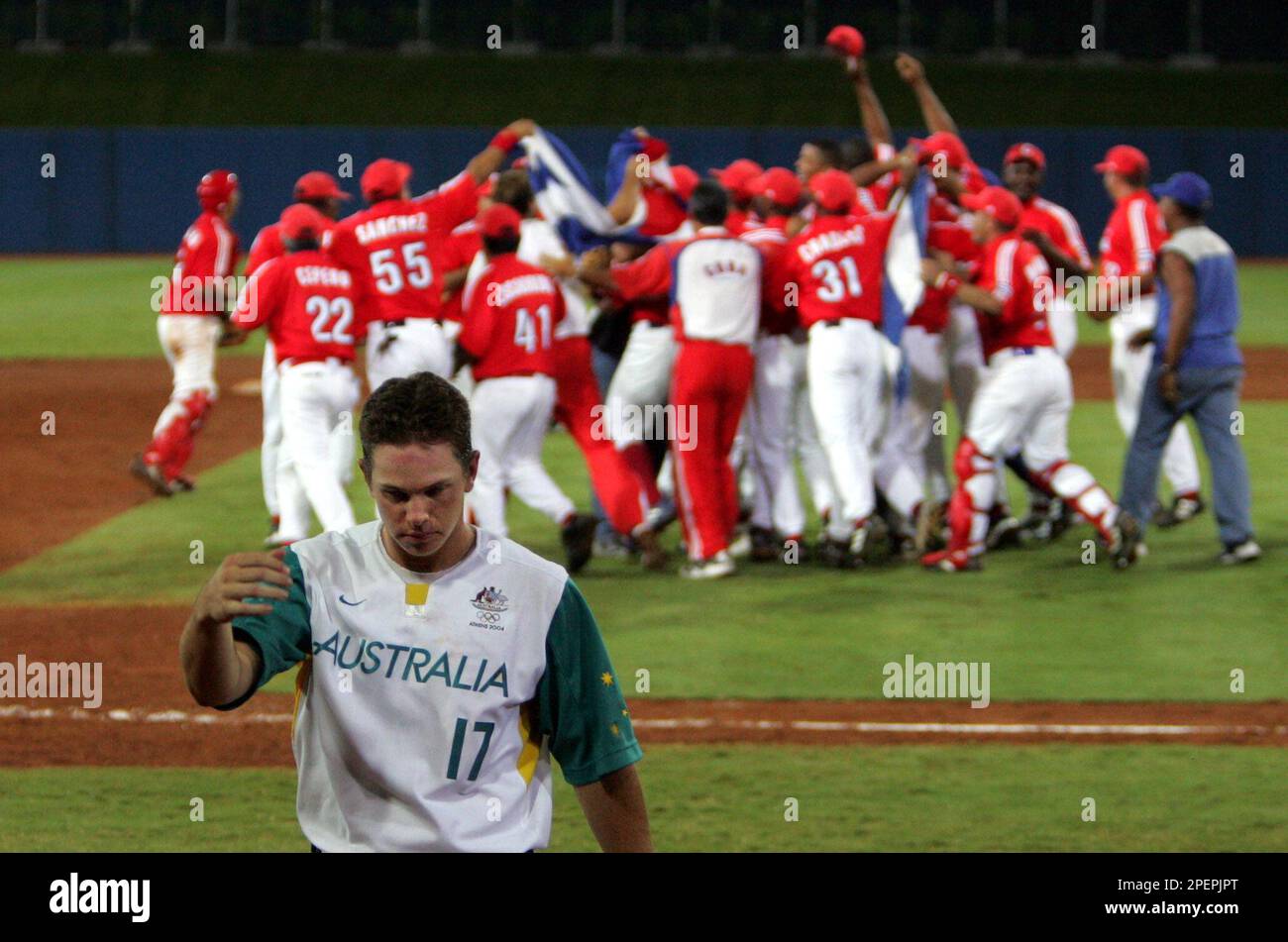 Australia's Brett Roneberg (17) walks off the field as the Cuba ...