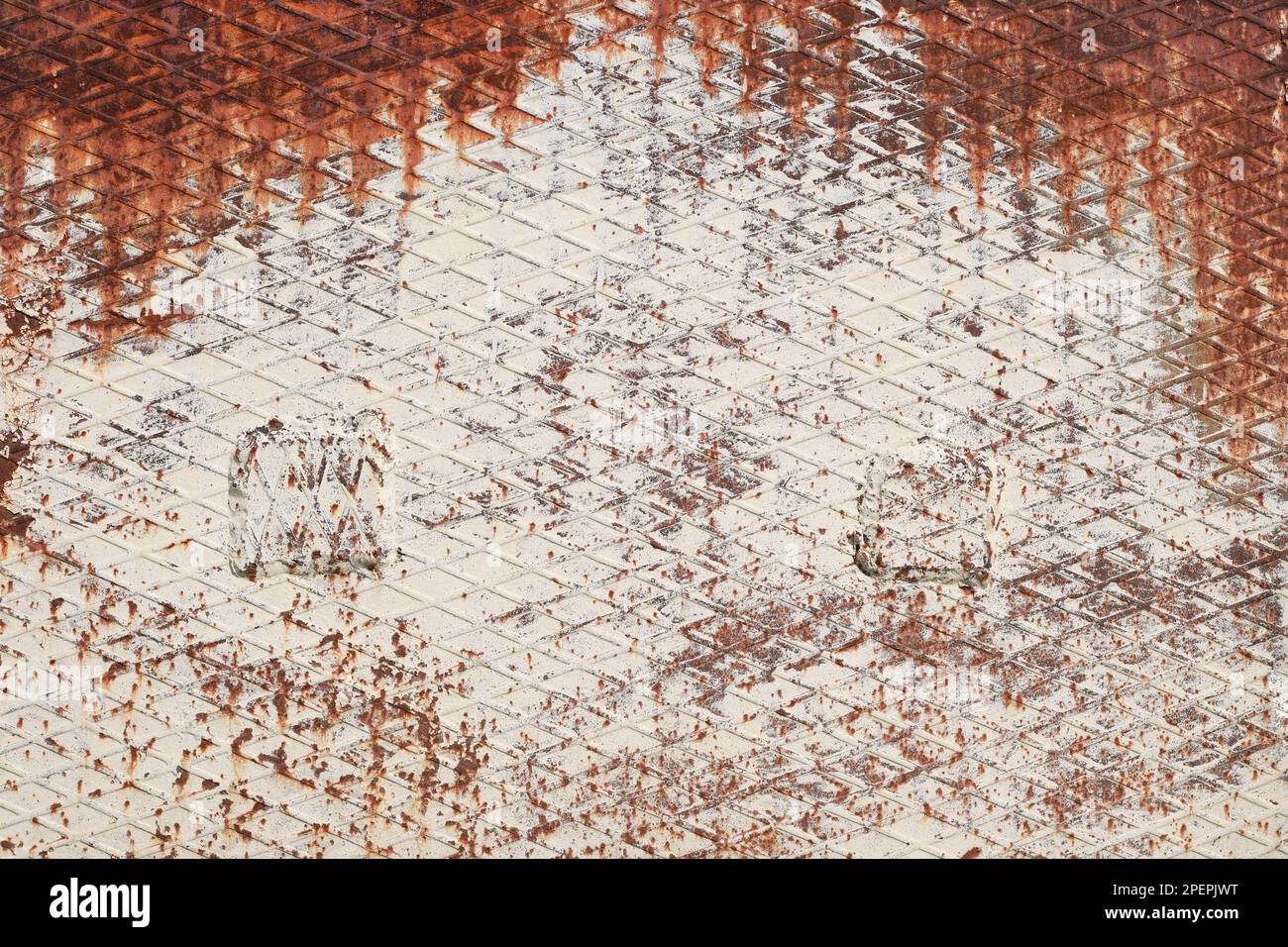 Corrugated rhombic rolled steel sheet with rust. White painted metal ...