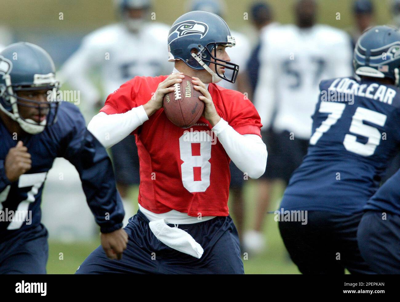 Seattle Seahawks quarterback Matt Hasselbeck, center, sets to pass ...