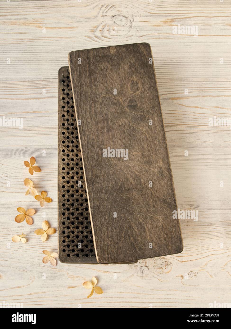 Woood brown Sadhu board and dry hydrangea flowers. Bed of Nails. Yogic ...