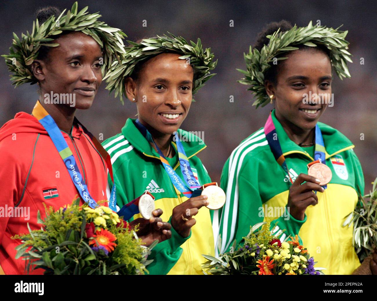 Medalists for the 5000m are, from left, silver medalist Isabella ...