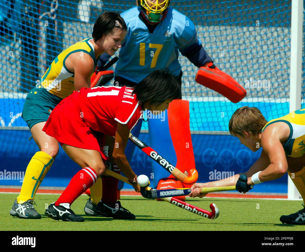 Japan's Komori Tomomi, center, fights for the ball with Australia's ...