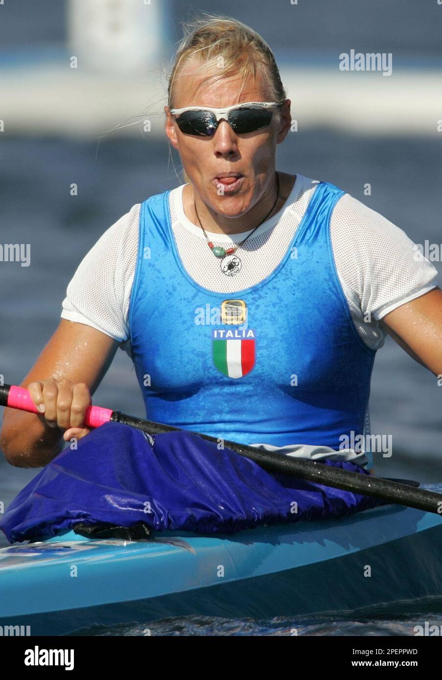Defending Olympic champion Josefa Idem of Italy reacts after she took ...