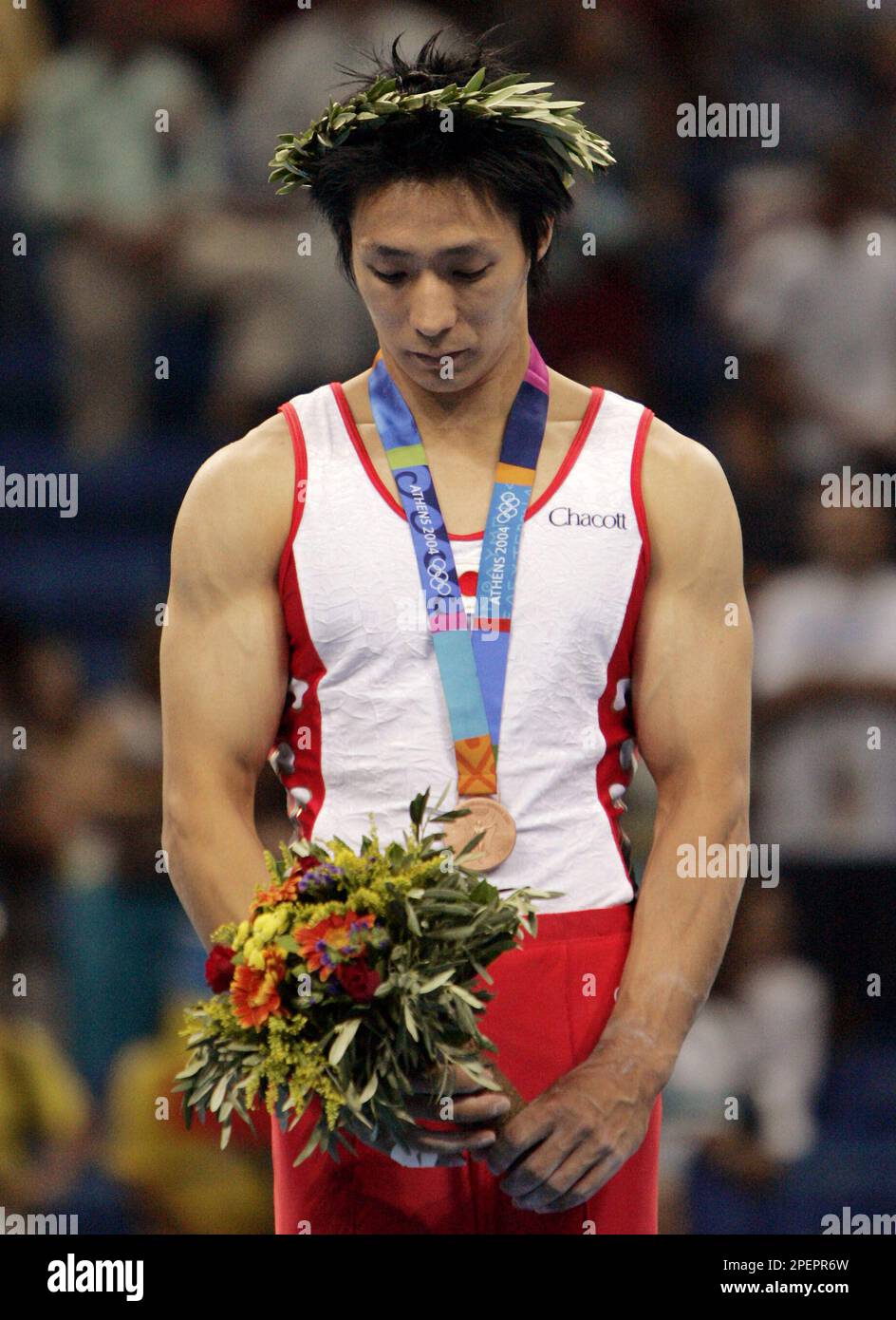 Japan's Isao Yoneda looks down at his bronze medal during the medal ...