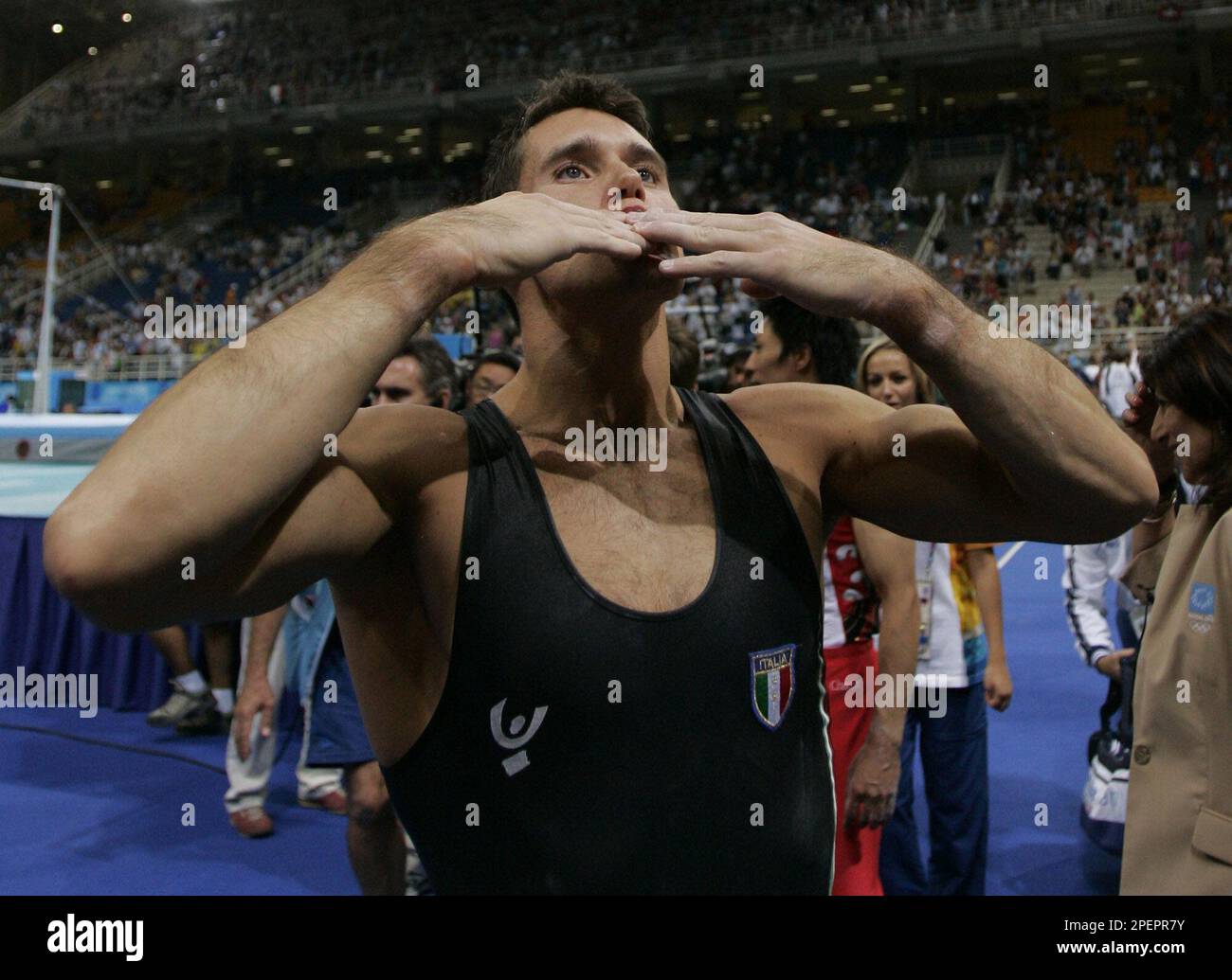 Igor Cassini of Italy acknowledges the crowd after his gold medal win ...