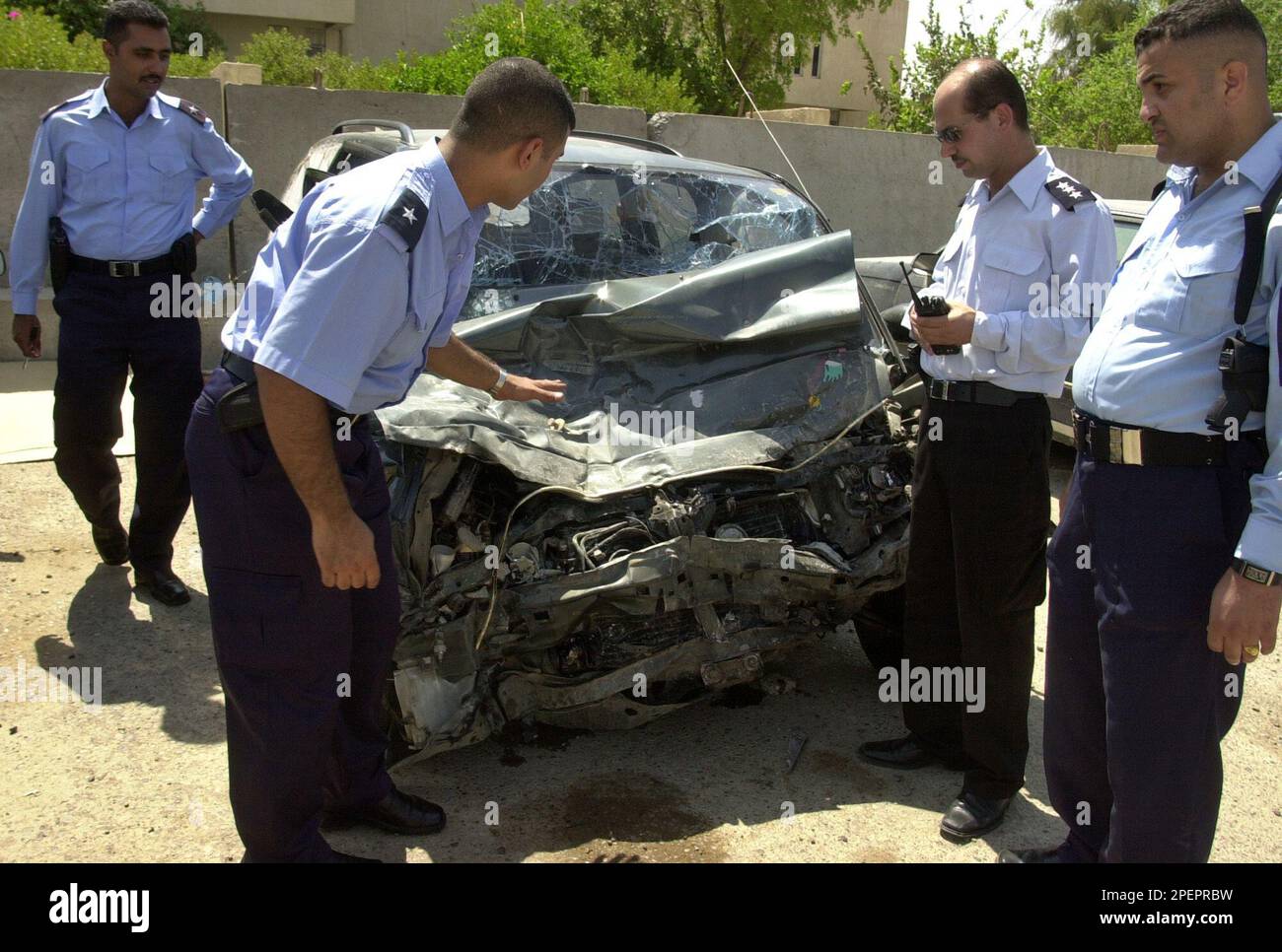 Iraqi police look at the car of civilian engineer Firas Ibrahim, who ...