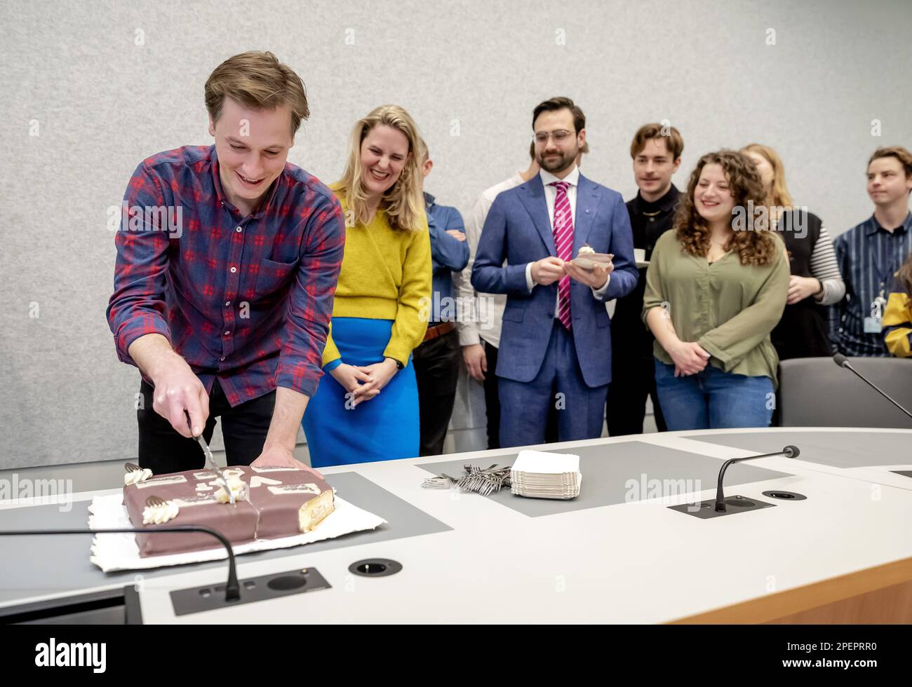 THE HAGUE - Laurens Dassen (VOLT) cuts the cake, one day after the ...