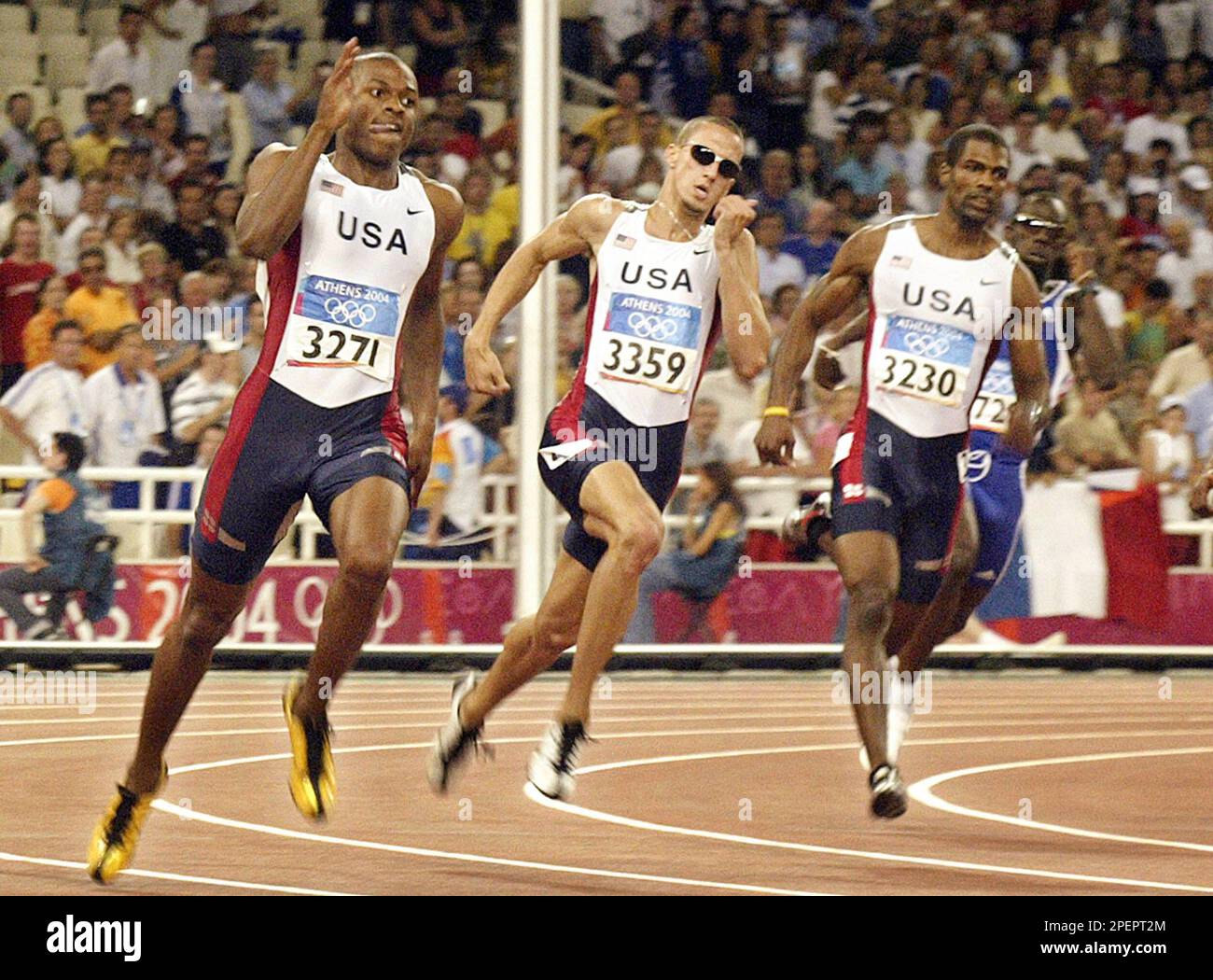 Jeremy Wariner, of the United States, center, wins the gold medal in ...