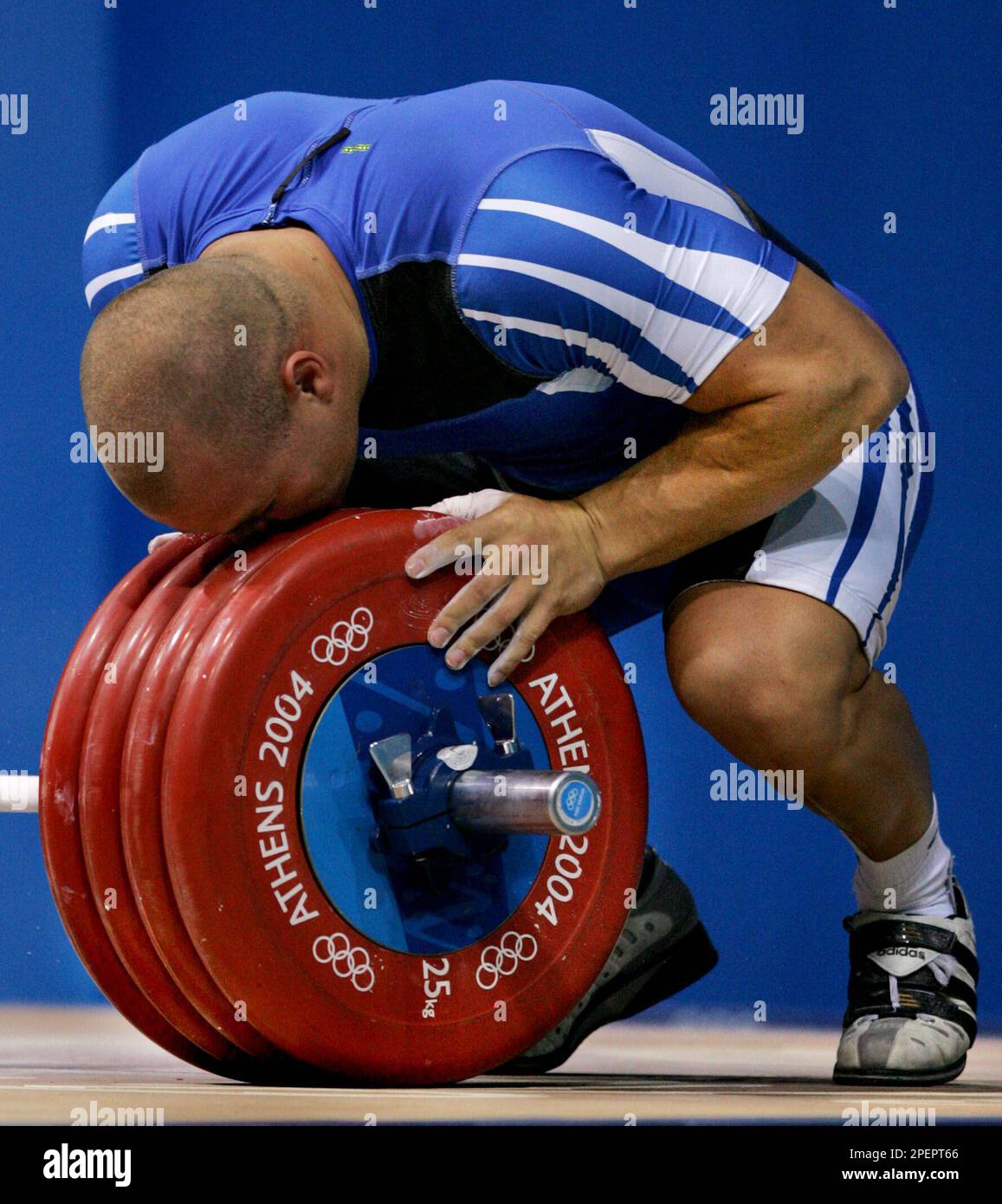 Milen Dobrev of Bulgaria kisses the barbell after winning the gold ...