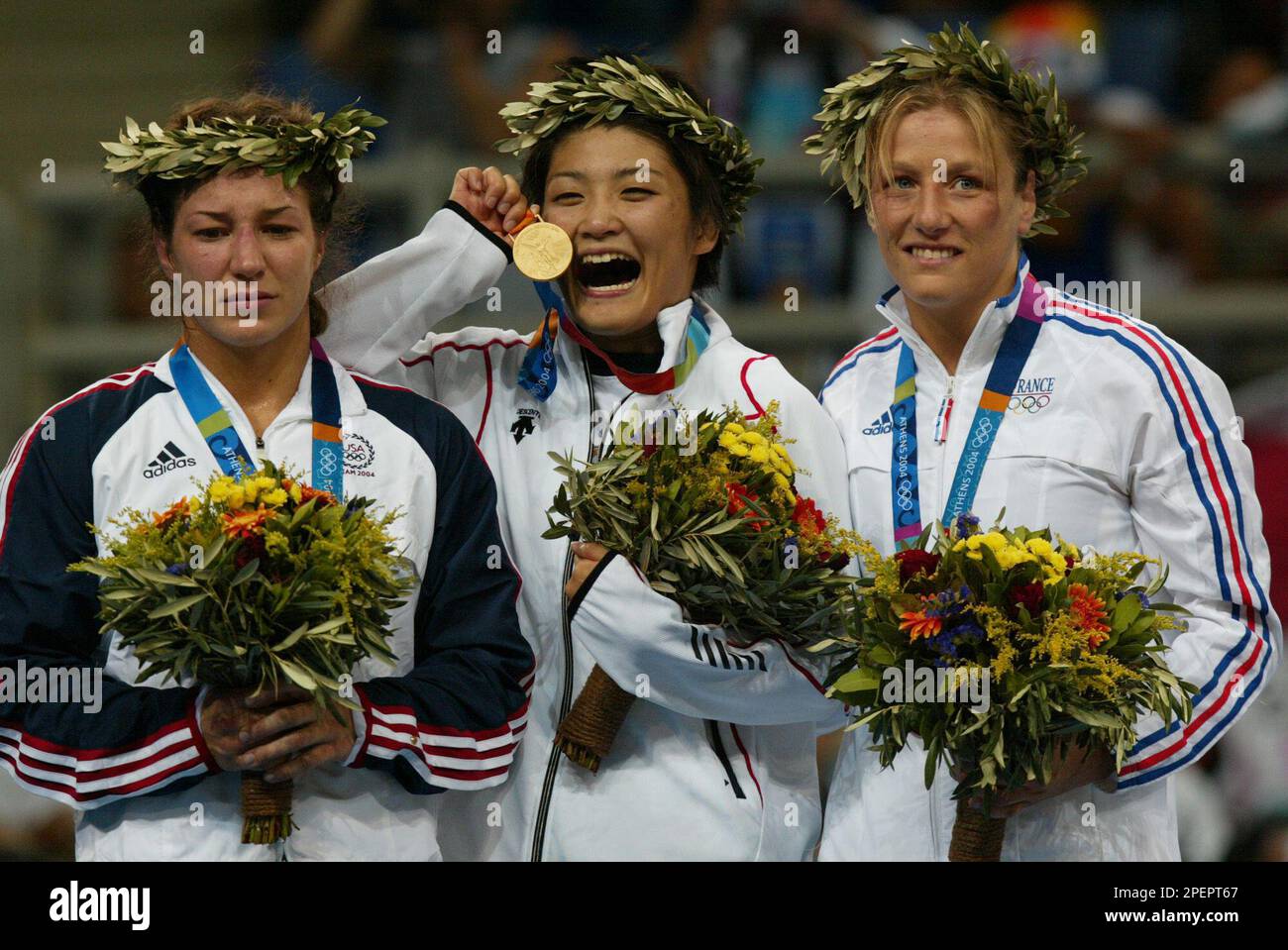 Medal winners of the women's freestyle 63kg wrestling final match at ...