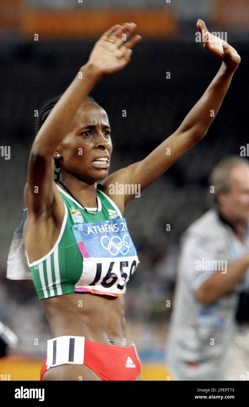 Meseret Defar of Ethiopia, reacts after winning the gold medal in the ...