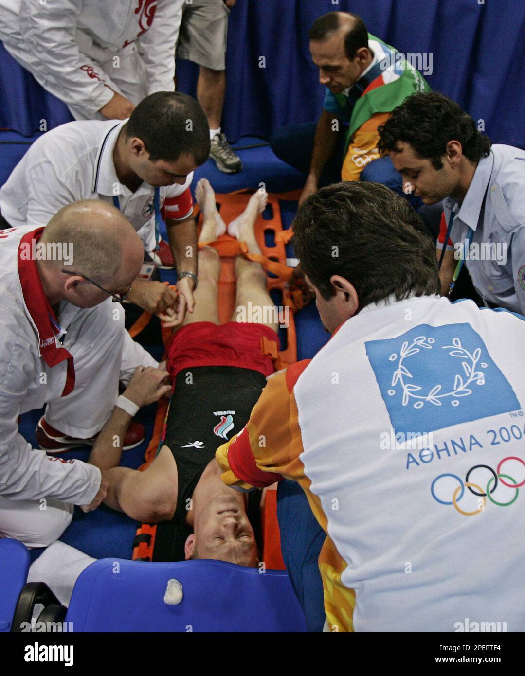 Russia's Alexei Bondarenko is treated by medical personnel after ...