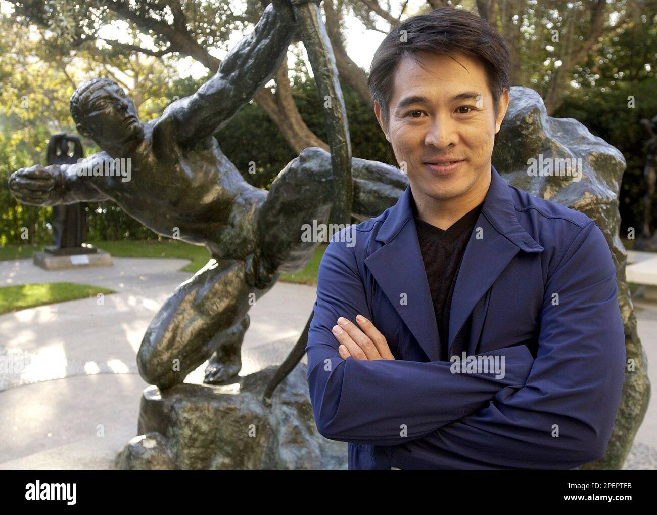 Actor Jet Li poses for a portrait in front of a Rodin sculpture at the ...