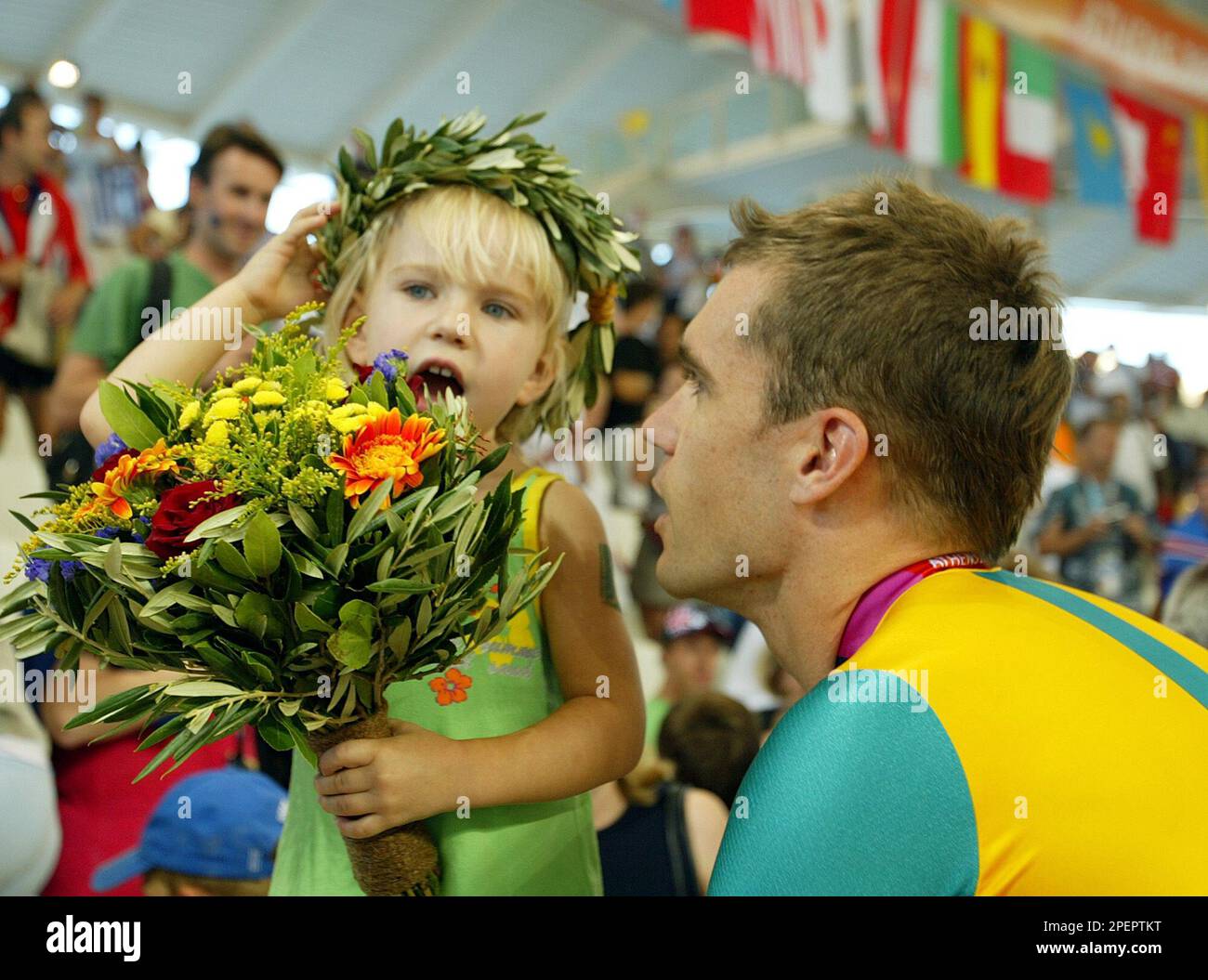 Australia's Bradley McGee puts the laurel on his daughter Tahlia's head ...