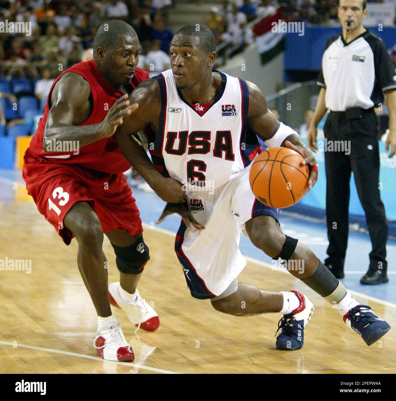 Dwyane Wade Jr., right, drives on Angola's Carlos Almeida in the second ...