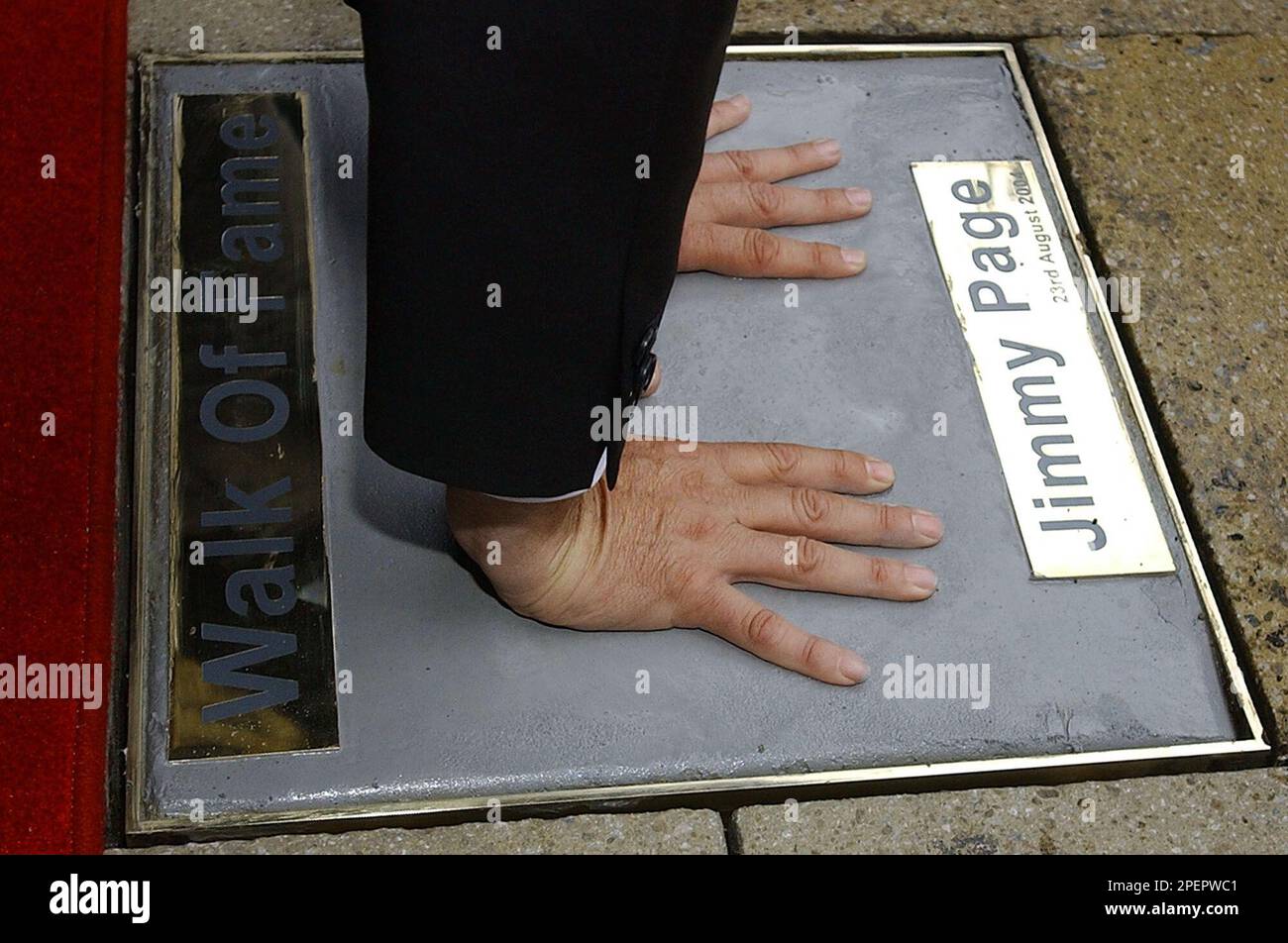 Jimmy Page, the founder member of the rock group Led Zeppelin, places ...