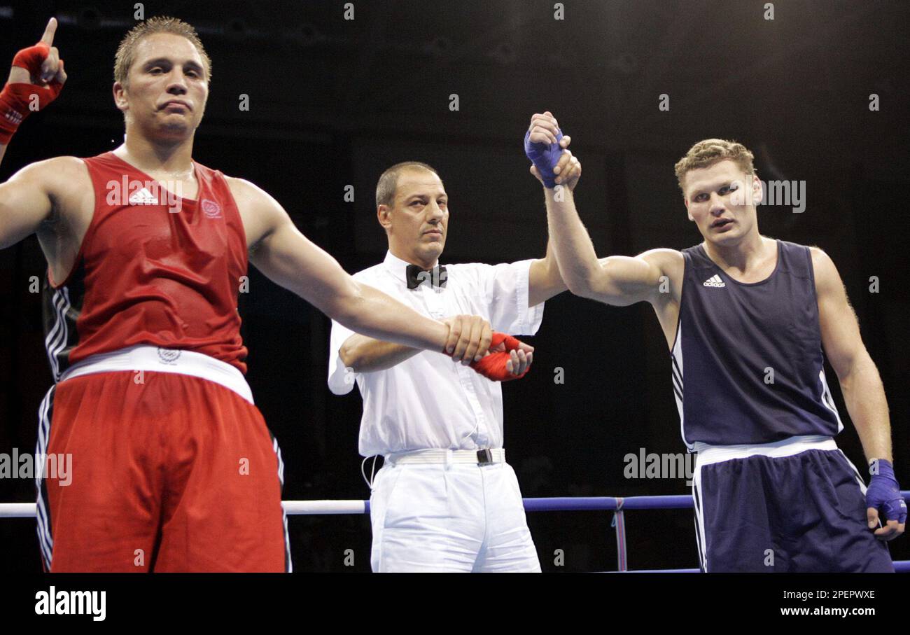 USA's Devin Vargas, left, from Toledo, Ohio, flashes "No. 1" signal while referee declares ...