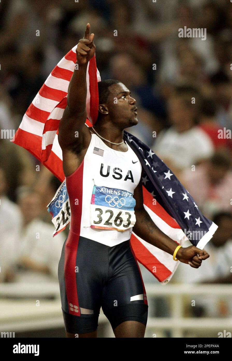 Justin Gatlin, of the United States, reacts after winning the gold ...