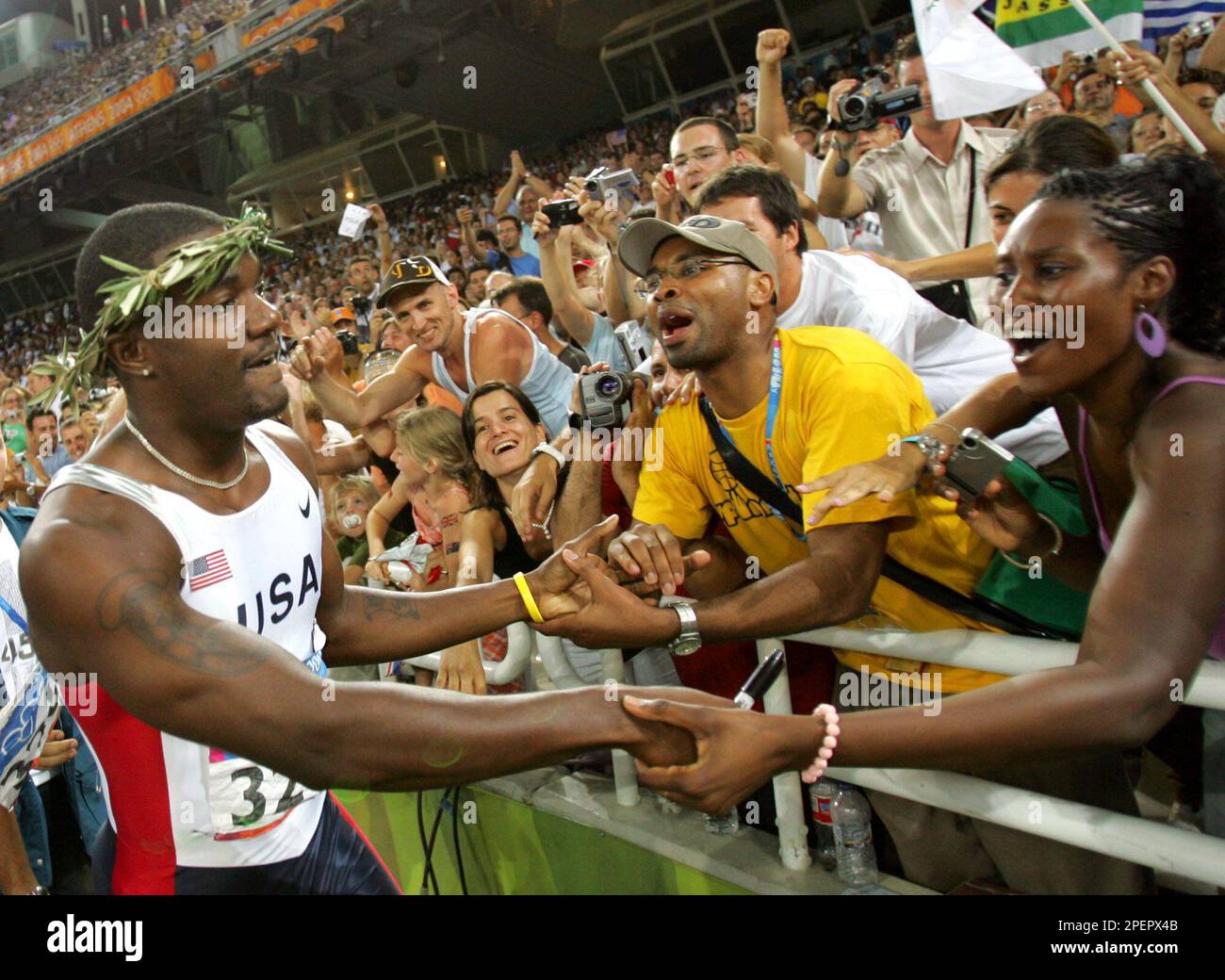 Justin Gatlin, of the United States, celebrates with the crowd after ...