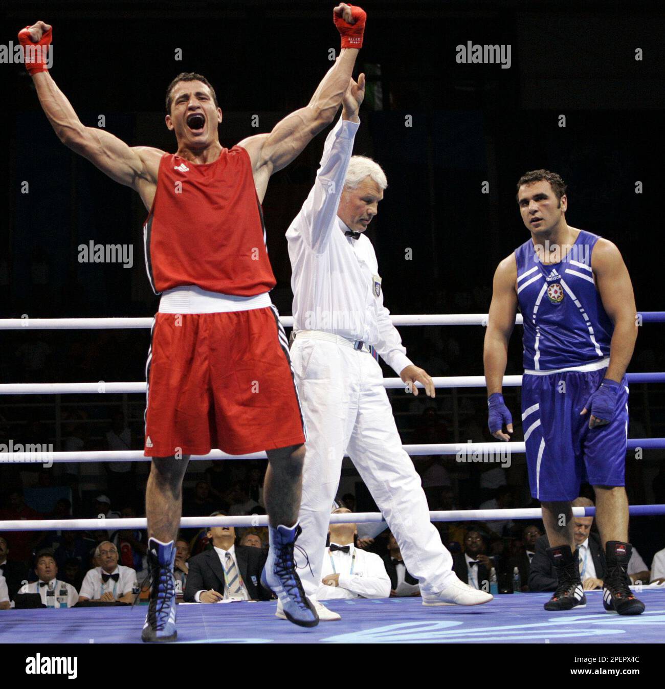 Syria's Naser Al Shami, left, celebrates his victory over Azerbaijian's ...