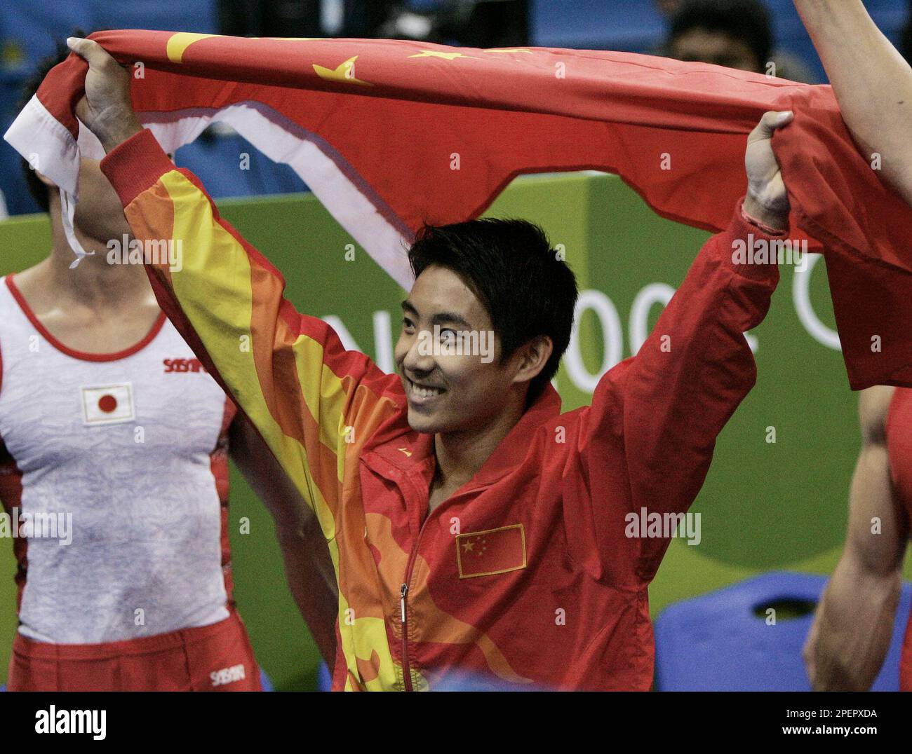 China's Teng Haibin celebrates his gold medal in the pommel horse ...