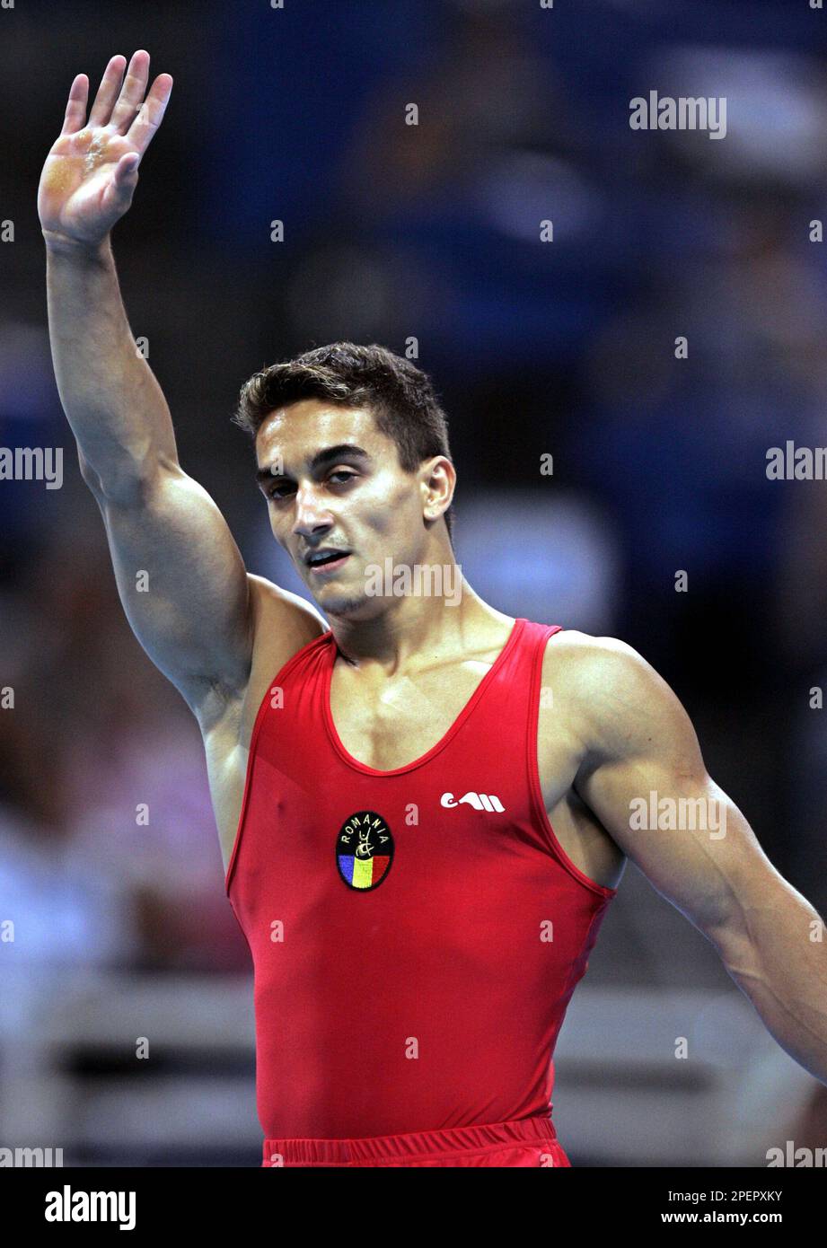 Marian Dragulescu of Romania acknowledges the crowd after completing ...