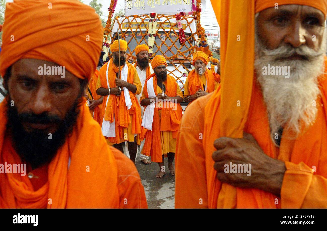 Members of Sikh community lead a religious procession outside the ...