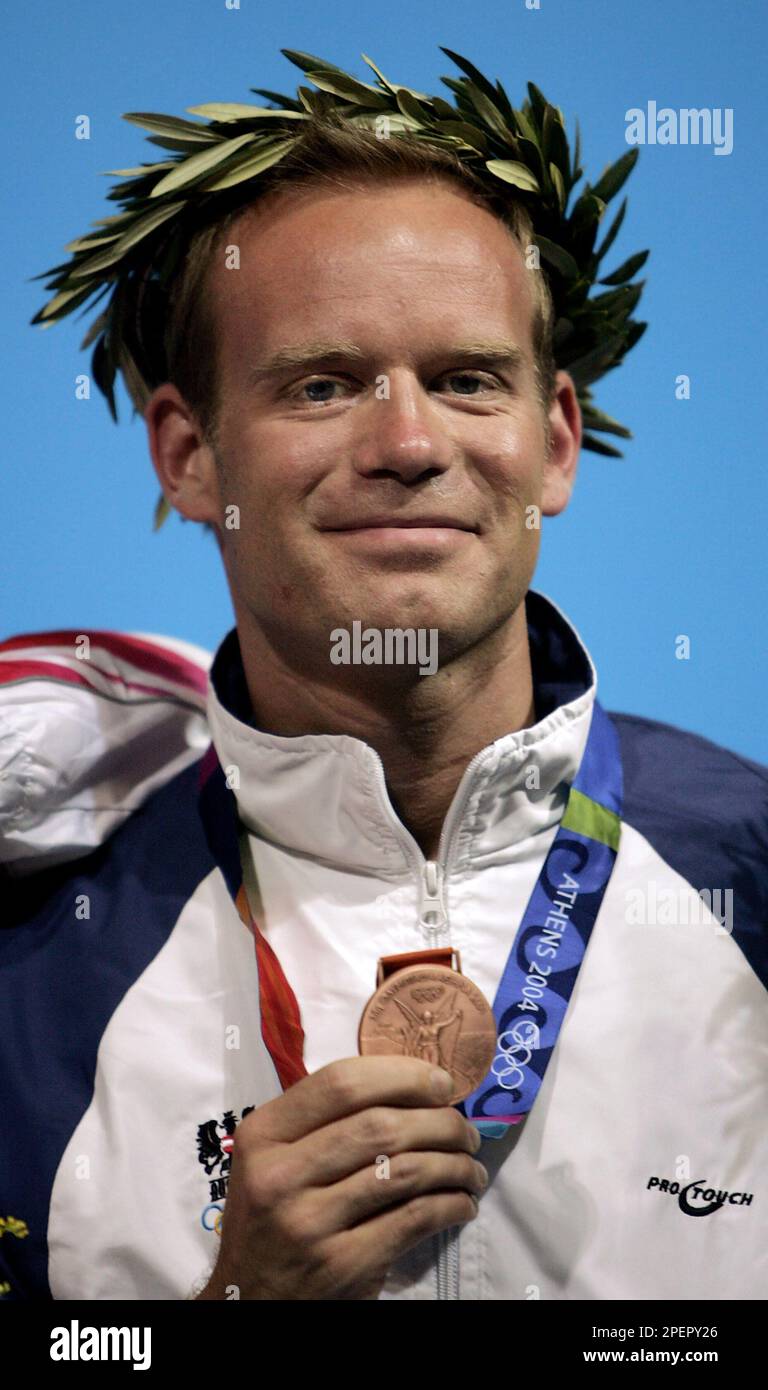 Austria's Christian Planer displays his bronze medal the men's 50m ...
