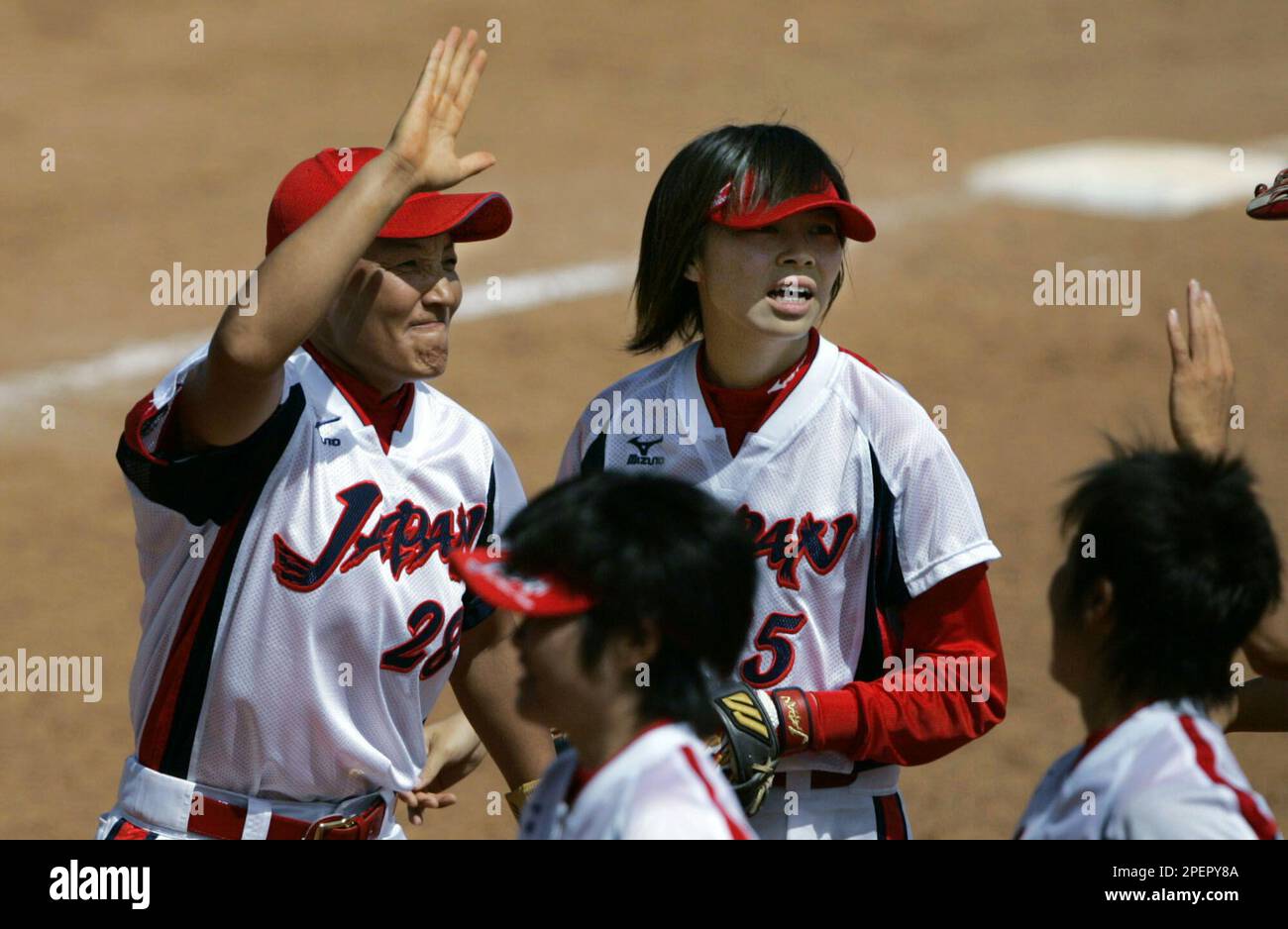 Japan's Reika Utsugi (28) and Yuki Sato share congratulations with ...