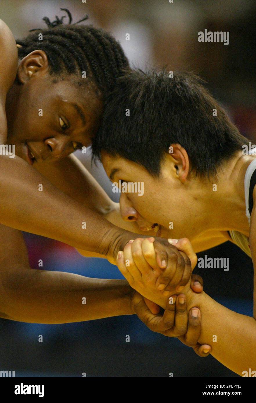 Kyoko Hamaguchi, from Japan, right, wrestles Toccara Montgomery of the ...