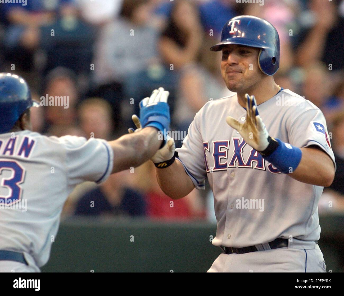Texas Rangers' Rod Barajas, right, is congratulated by Brian Jordan ...