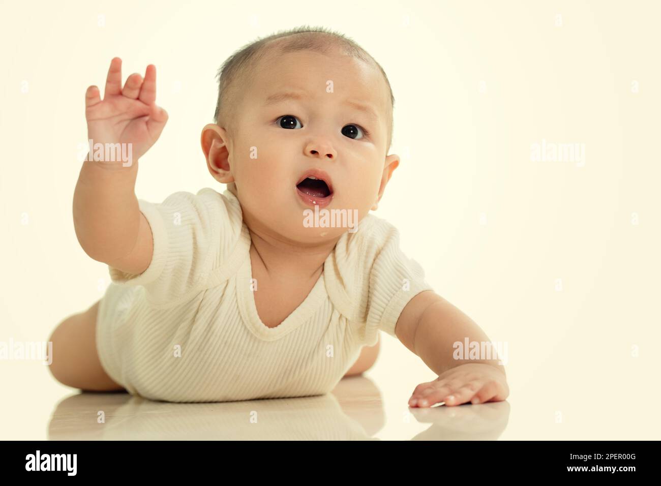 Baby lying play on hi-res stock photography and images - Alamy