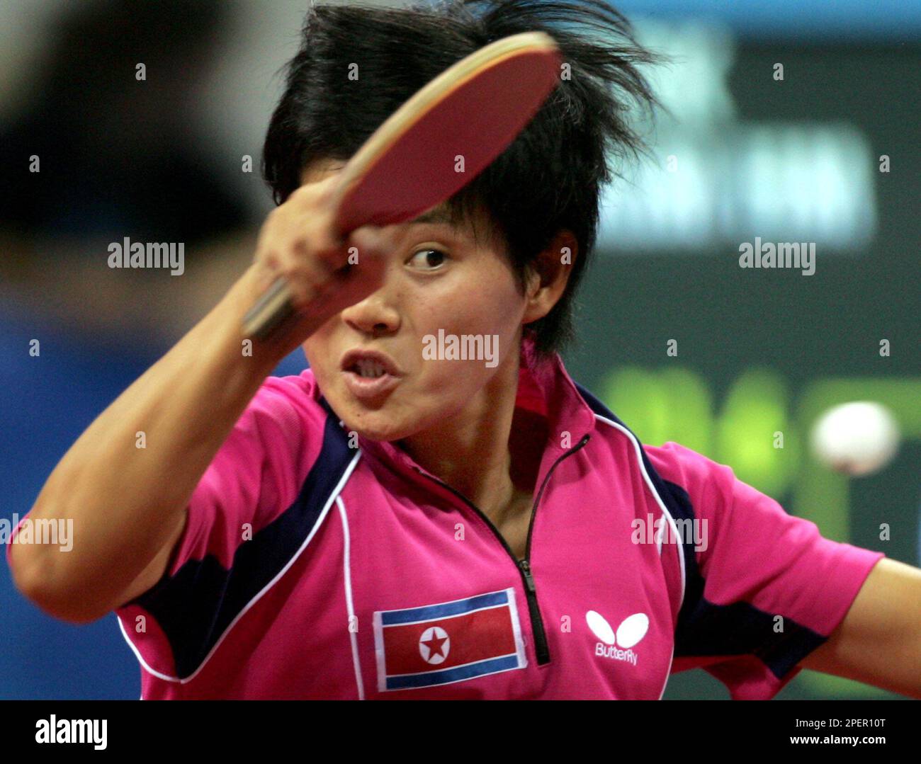 Korea's Kim Hyang Mi returns the ball against Singapore's Li Jia Wei in ...