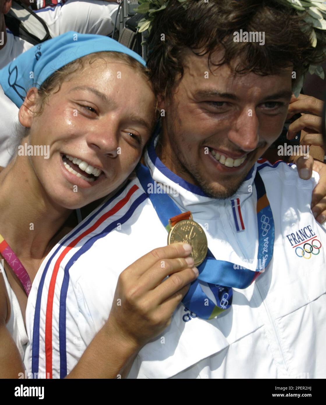 Greek K1 women's single kayak athlete Maria Ferekidi, right, shows her ...