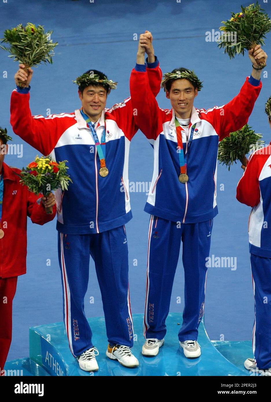 Korea's Kim Dong Moon, right, and Ha Tae Kwon wear their gold medals as ...